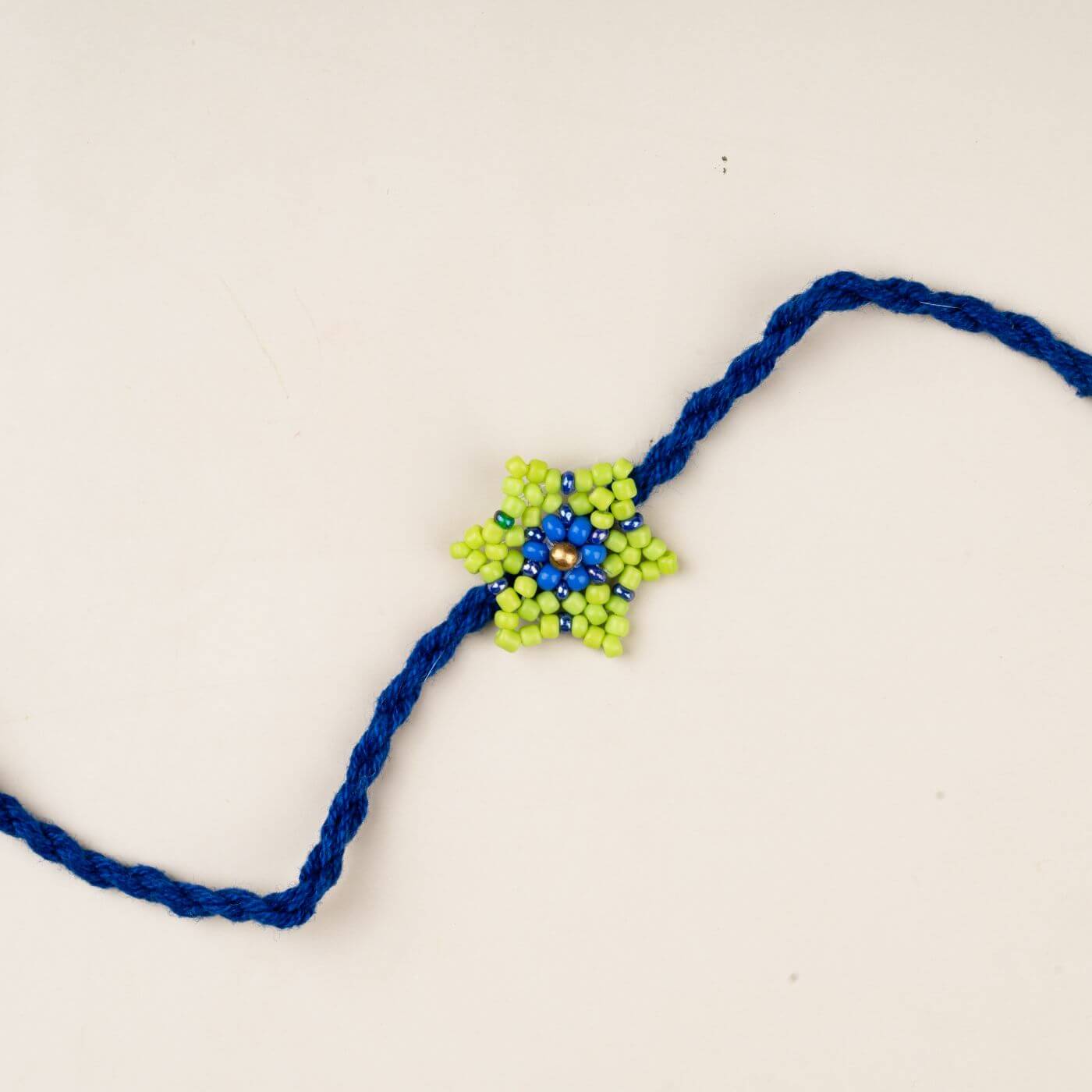 Buy Handcrafted Glass Beads Phool Rakhi With Roli Chawal Online On Zwende