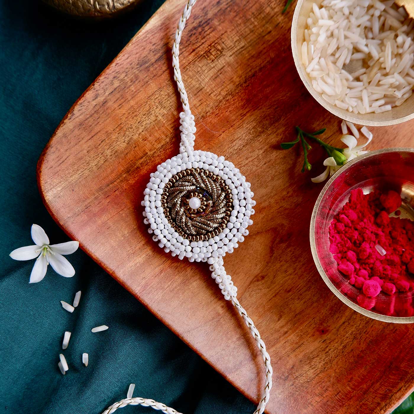 Buy Handmade Zardozi White Bead Border Rakhi With Wooden Box & Roli ...