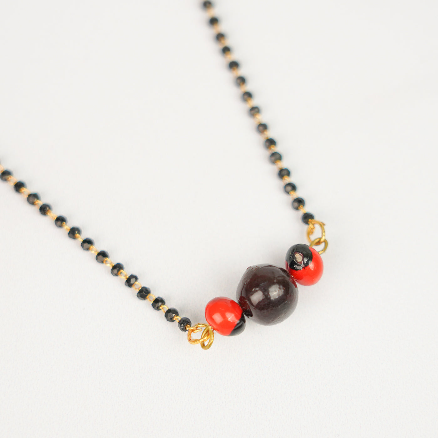 Buy Handmade Single Chain Crystal Beads Gunj & Reetha Seed Mangalsutra ...