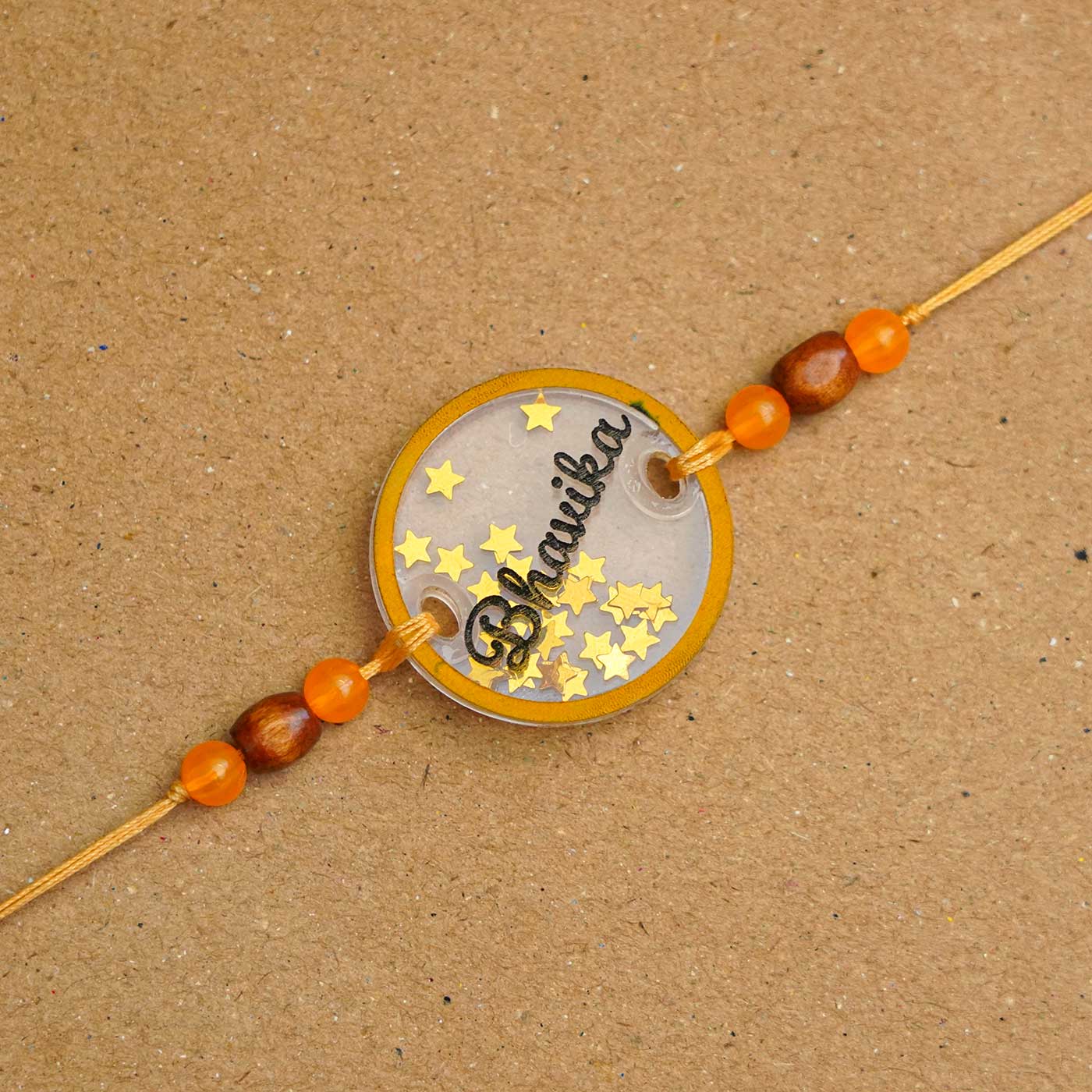 Buy Personalized Handmade Round Glitter Acrylic Rakhi With Roli Chawal ...