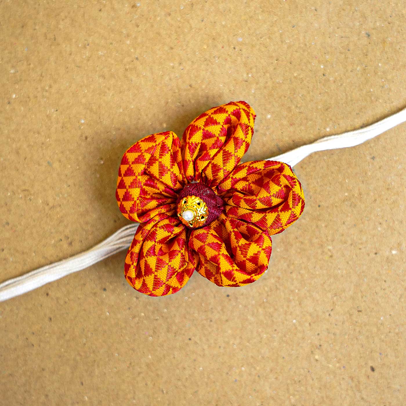 Buy Handmade Orange & Red Floral Fabric Rakhi With Roli Chawal Online ...